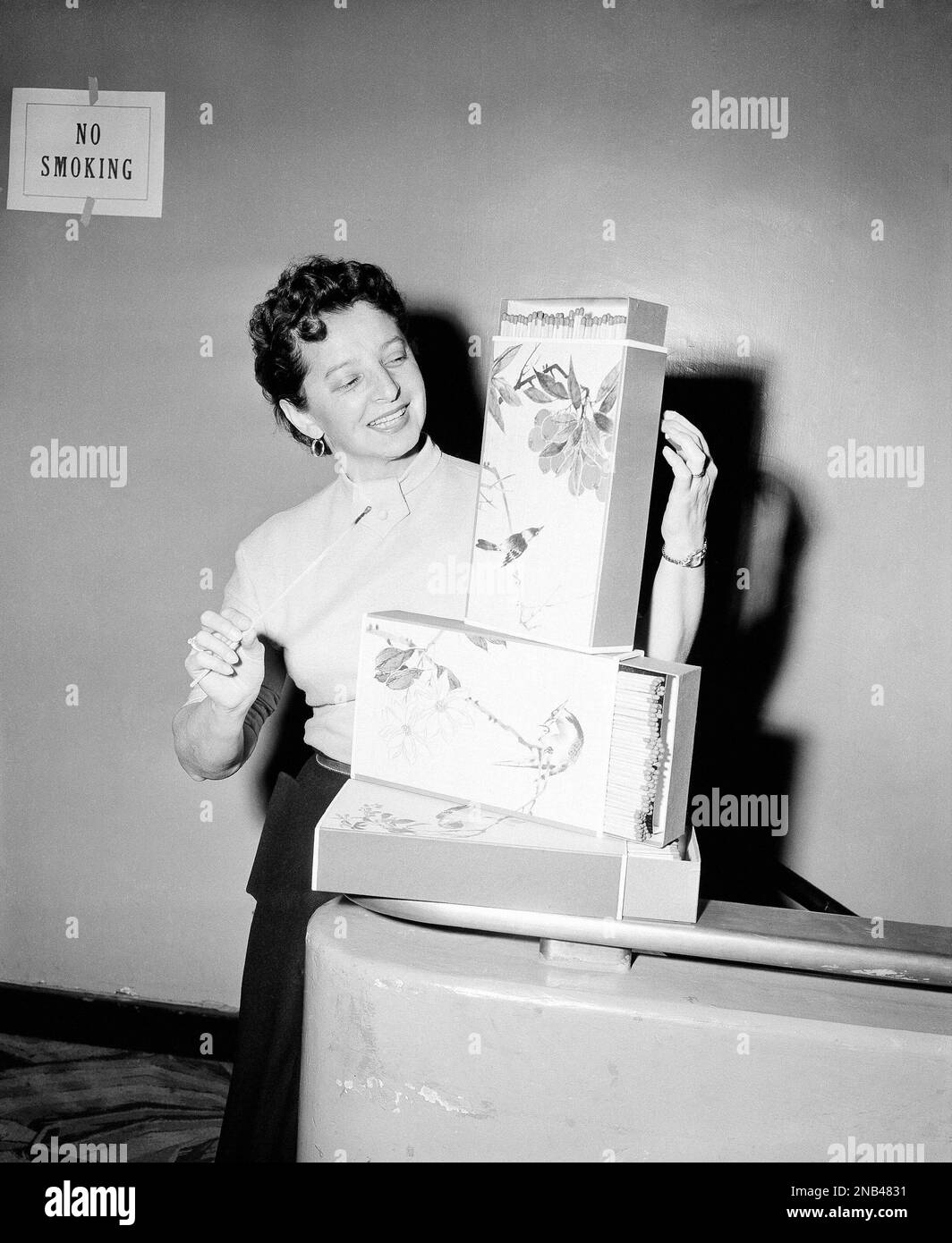 Rose Drayson stacks giant boxes of fireplace matches at the New York ...