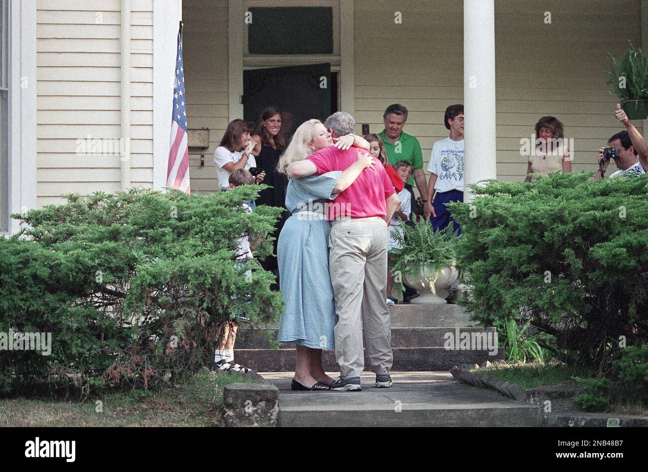 President Bill Clinton gets a hug from long-time friend Carolyn Staley ...