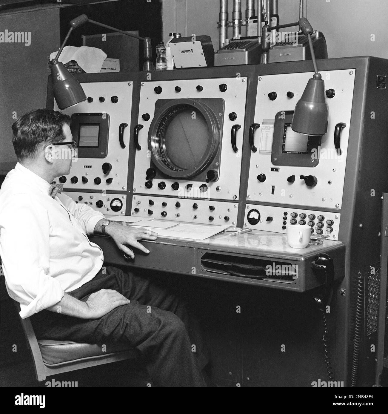 Meteorologist Douglas Barclay checks radar screens for storm ...