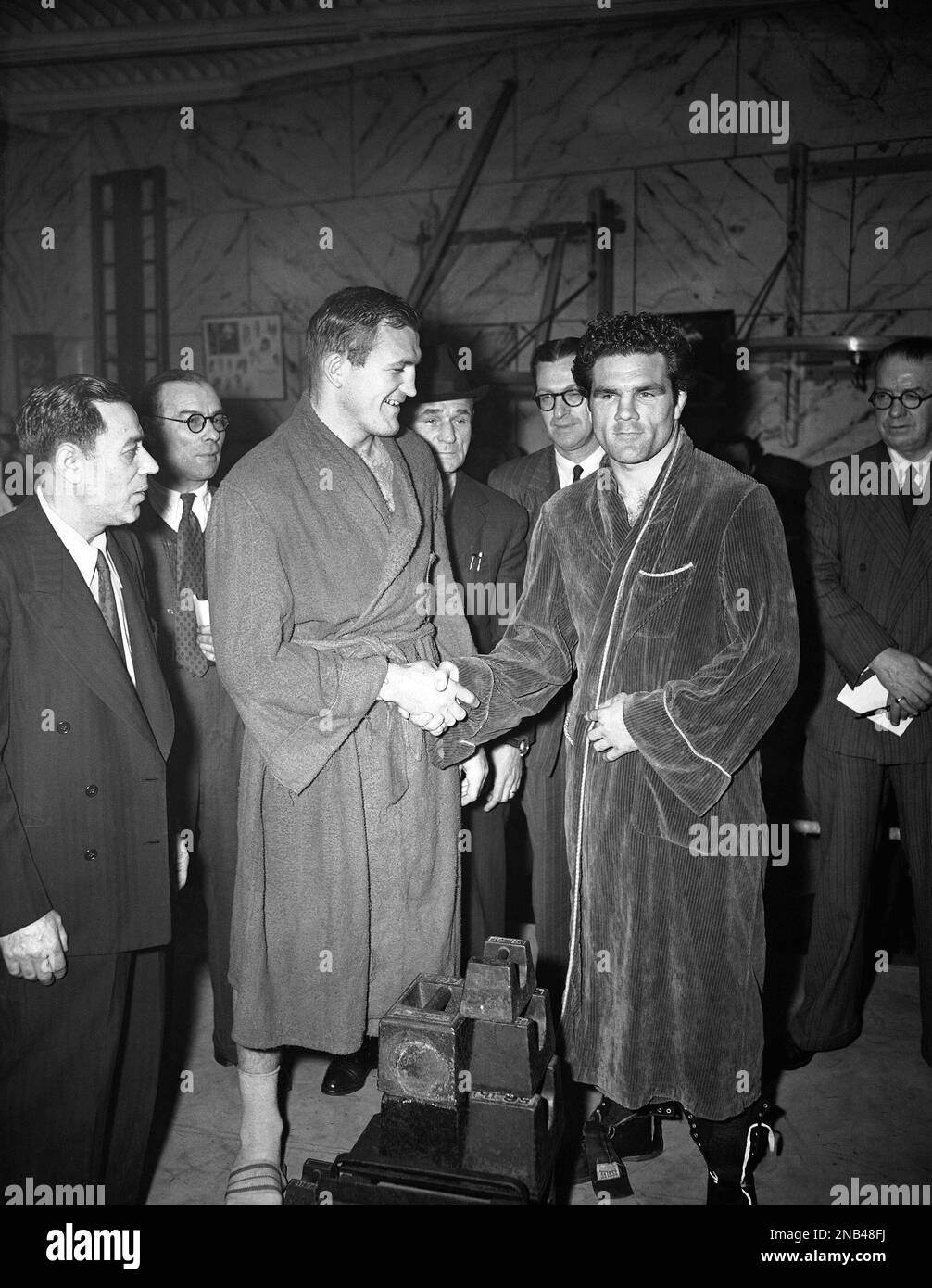 Joe Baksi of Pennsylvania, U.S.A., left, shakes hands with Britain's ...