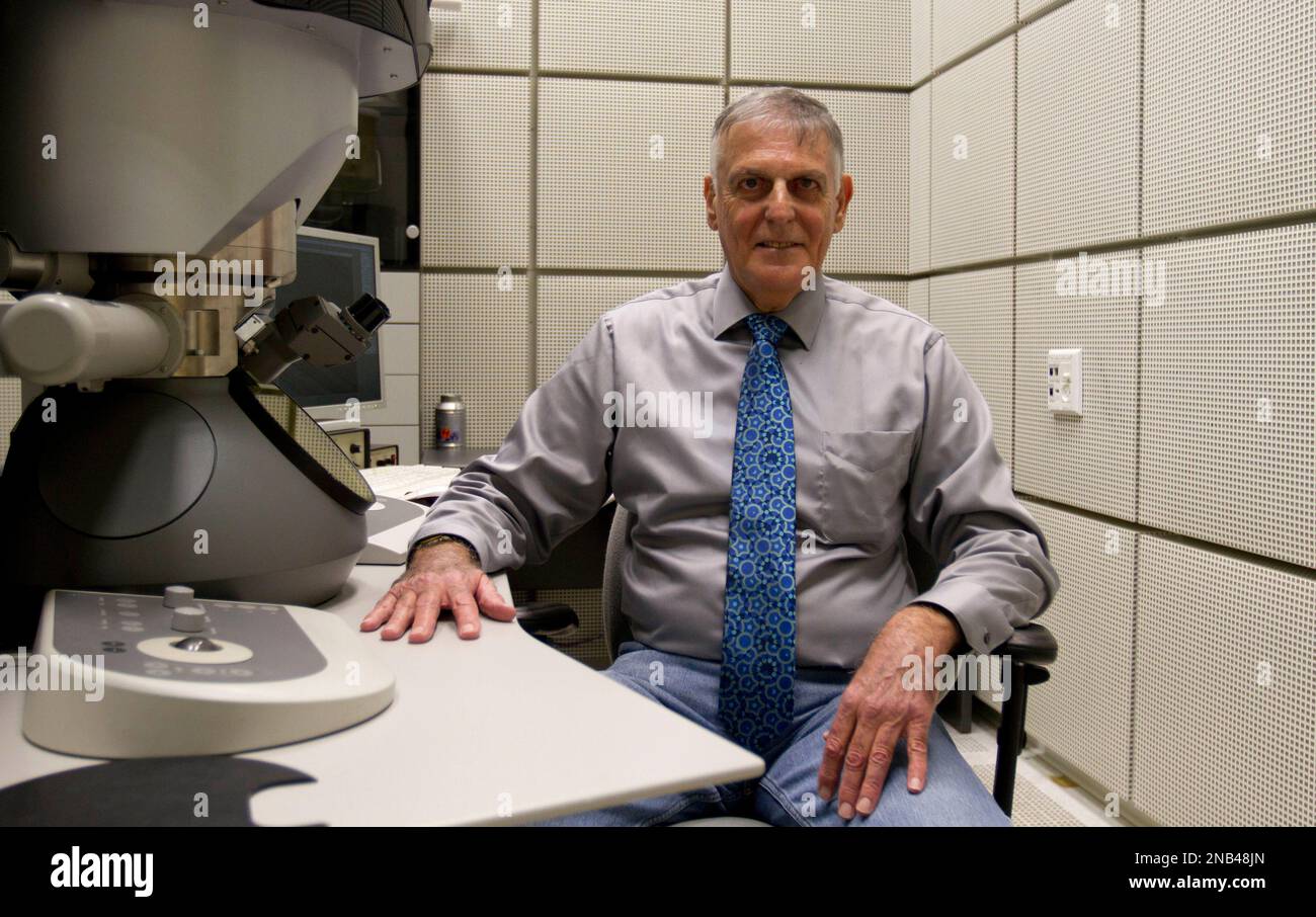 Israeli scientist Daniel Shechtman poses next to a transmission ...