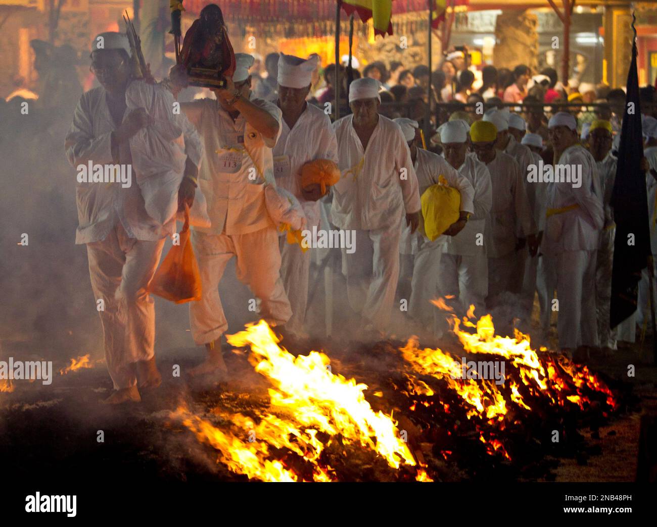 Malaysian ethnic Chinese walk barefoot over burning coals on the final ...