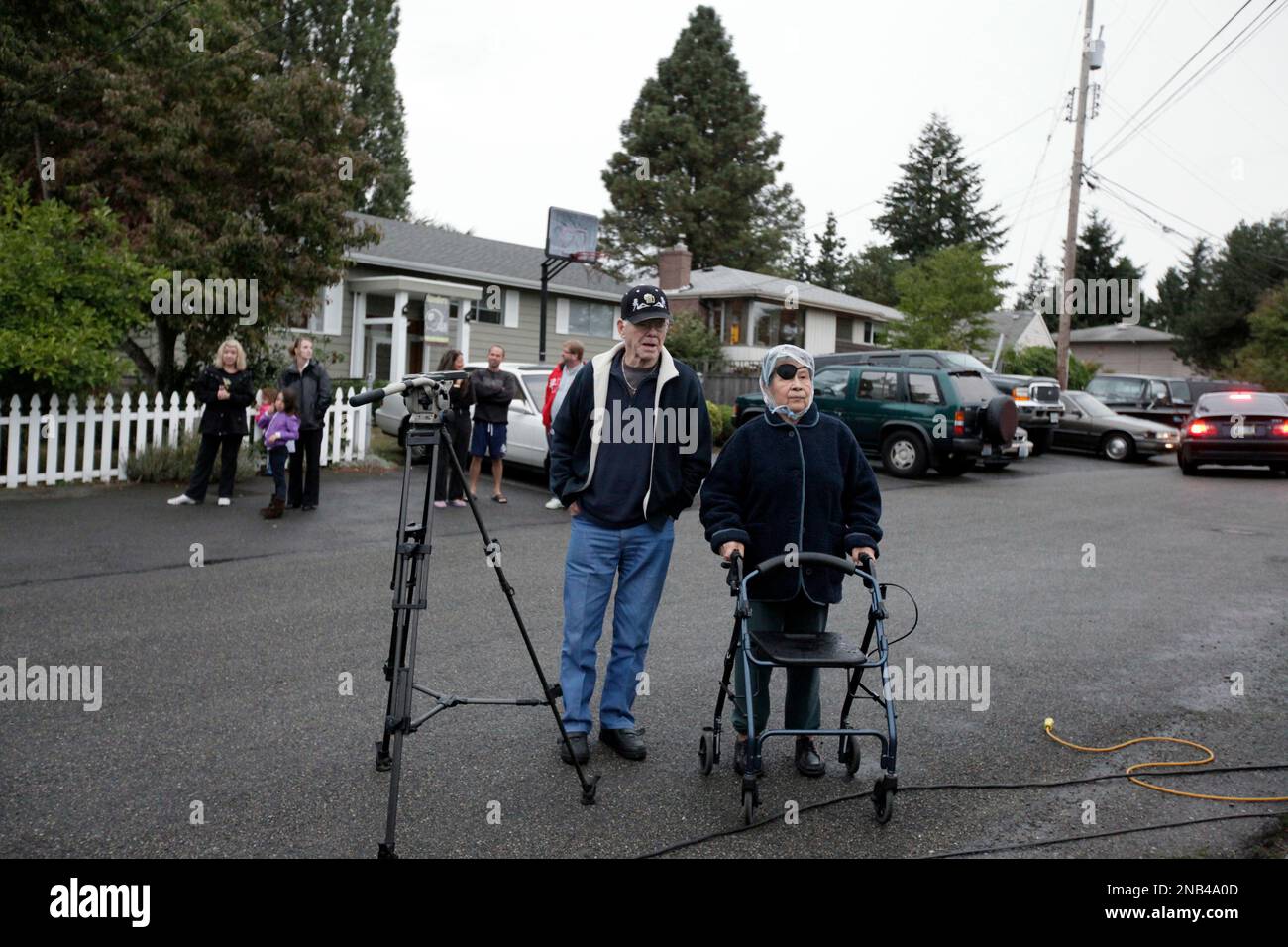 Neighbors Bill and Anna Mecham walked over to see what was going on in ...
