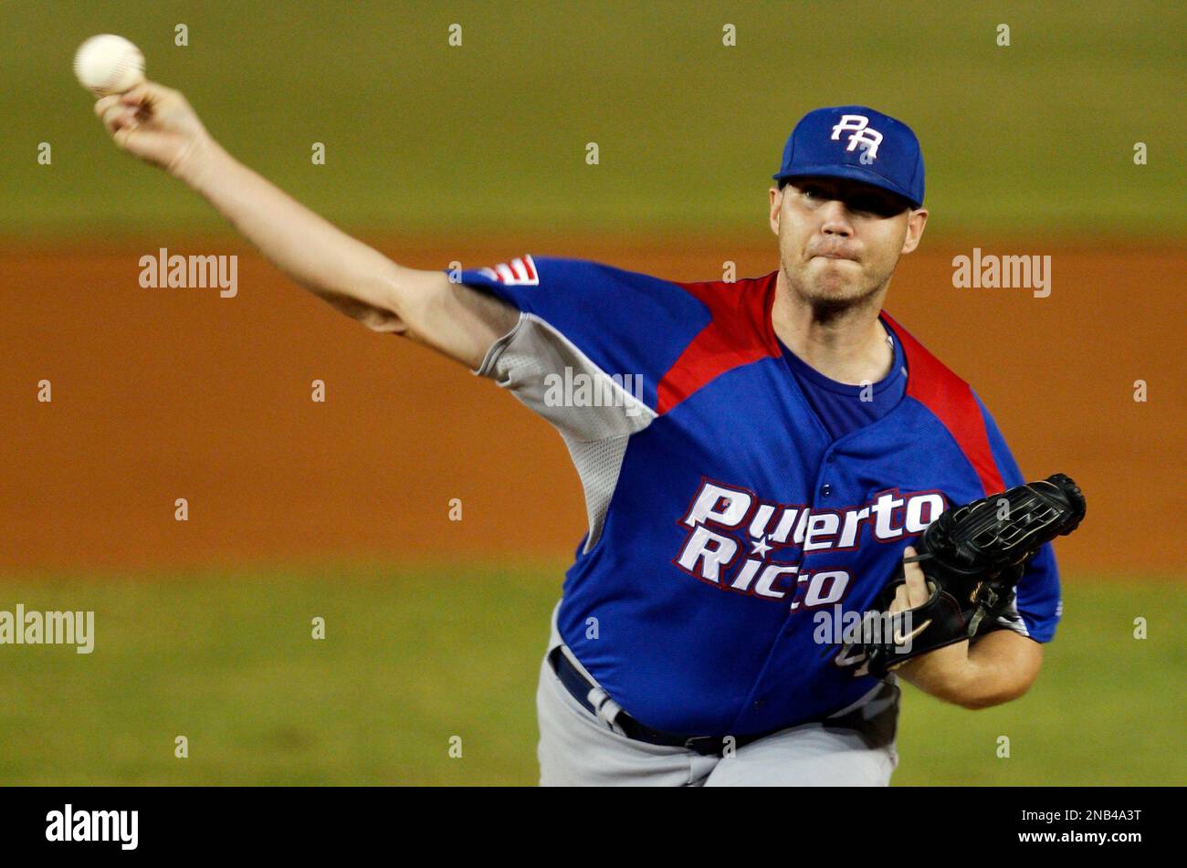 Puerto Rico's starting pitcher Ivan Maldonado throws in the first ...