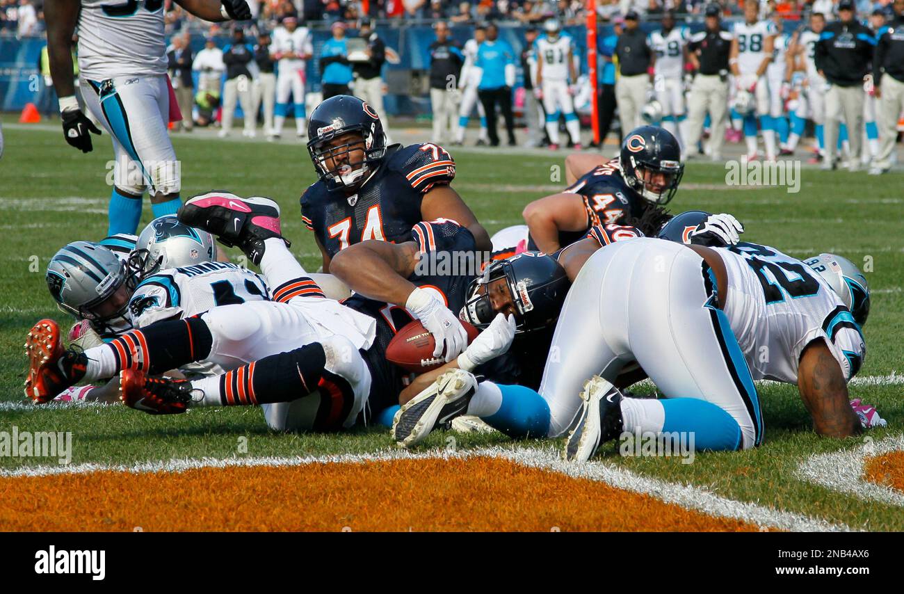 Chicago Bears running back Marion Barber, center, lands in the endzone ...
