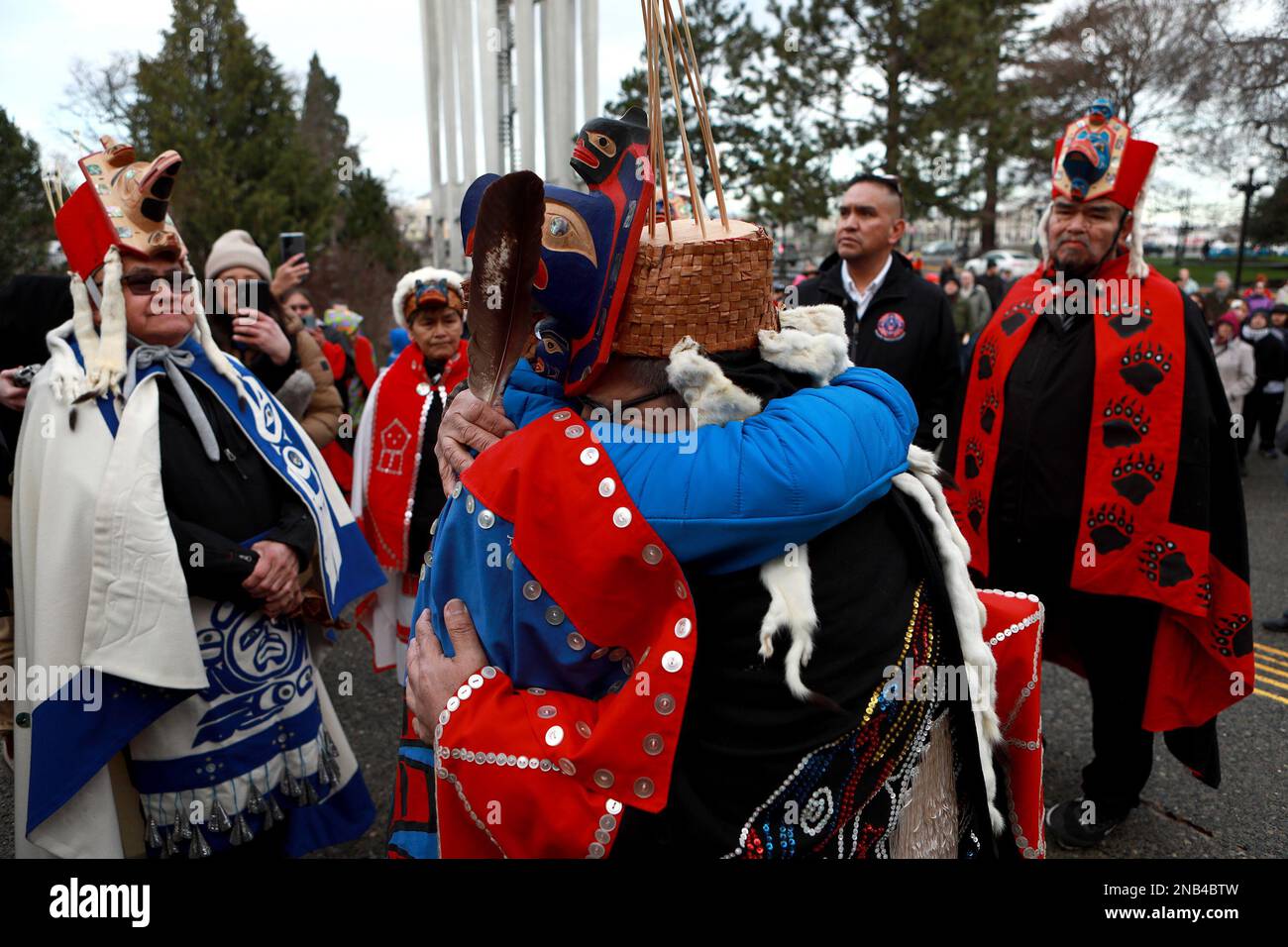 Hereditary chiefs hug one another as they witness the historical ...
