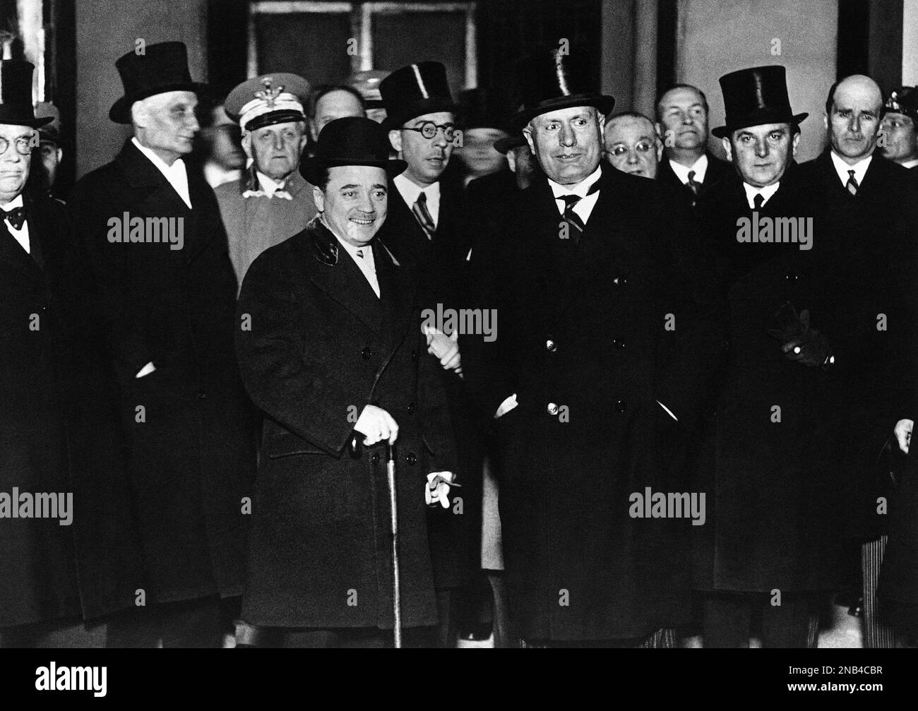 Chancellor Engelbert Dollfuss with Benito Mussolini as he arrived in ...
