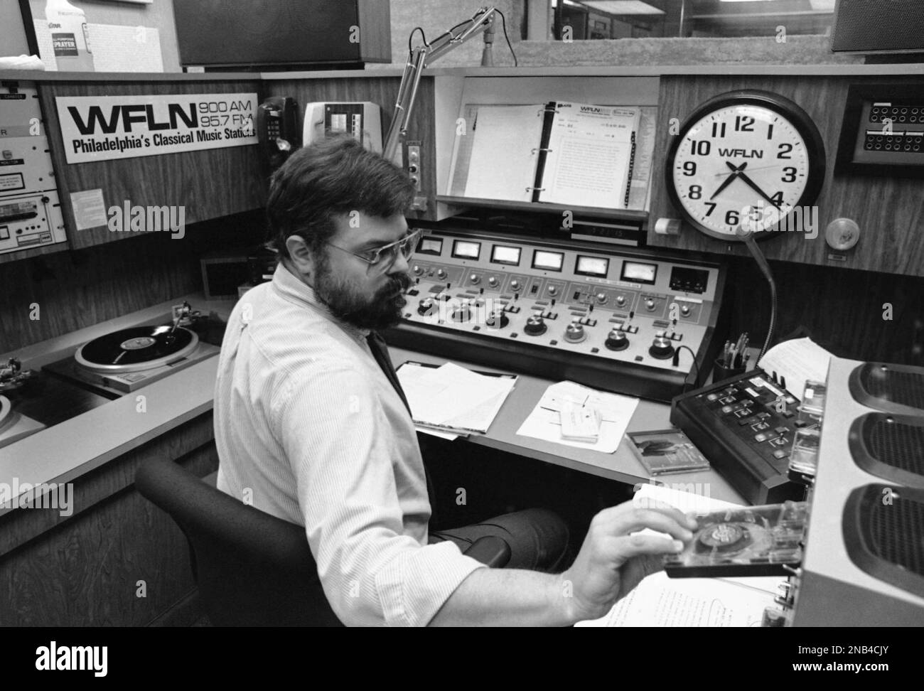 WFLN program director Dave Conant places in a tape during the morning ...