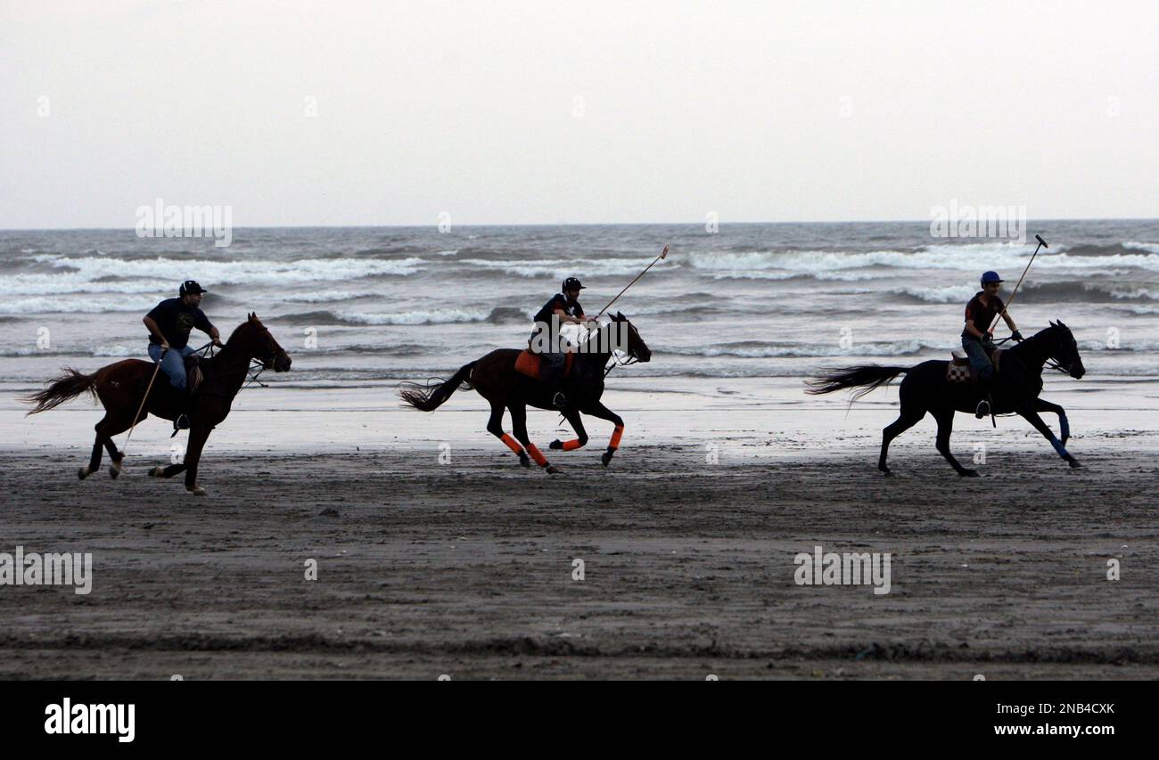Pakistani horse riders play polo at Karachi's beach in Pakistan, on ...