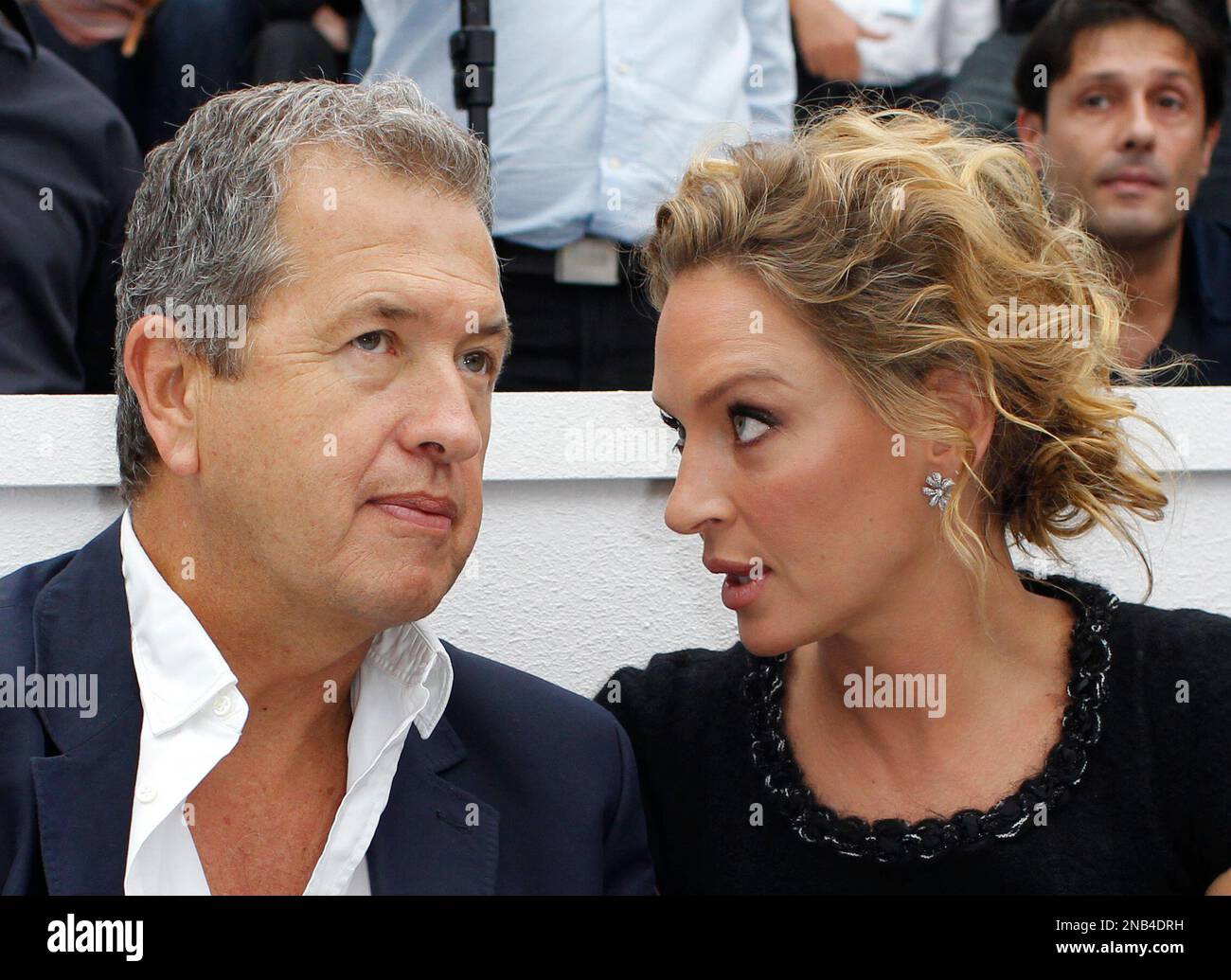 U.S actress Uma Thurman talks to Italian photographer Mario Testino ...