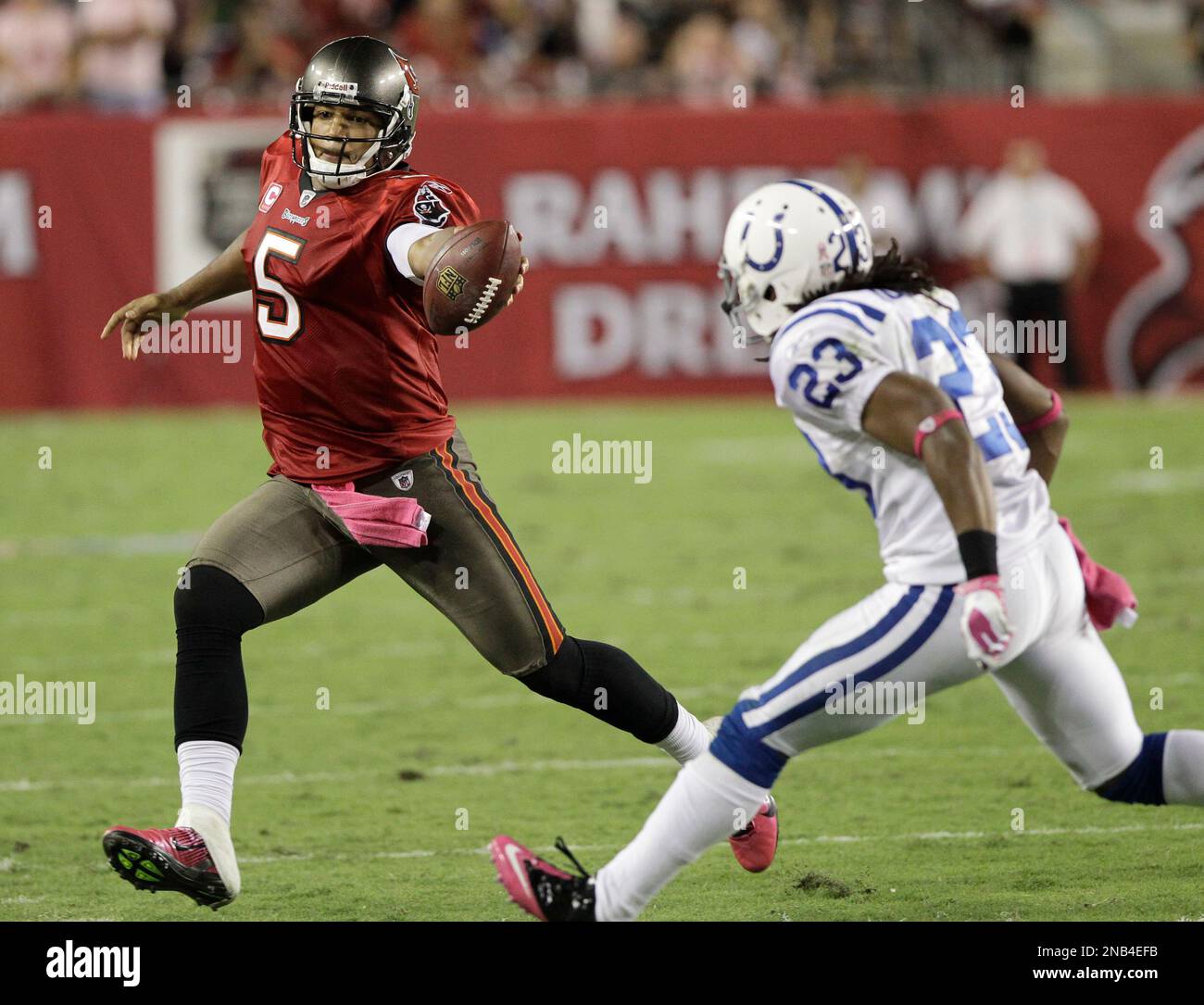 Tampa Bay Buccaneers quarterback Josh Freeman (5) scrambles out of ...