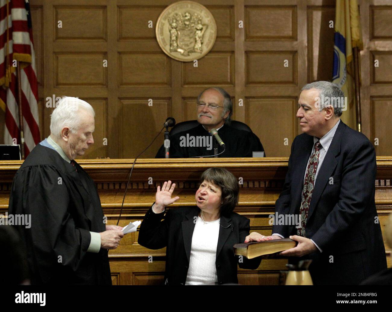 Donna Gallucio, center, is sworn in as New Jersey Supreme Court judge ...