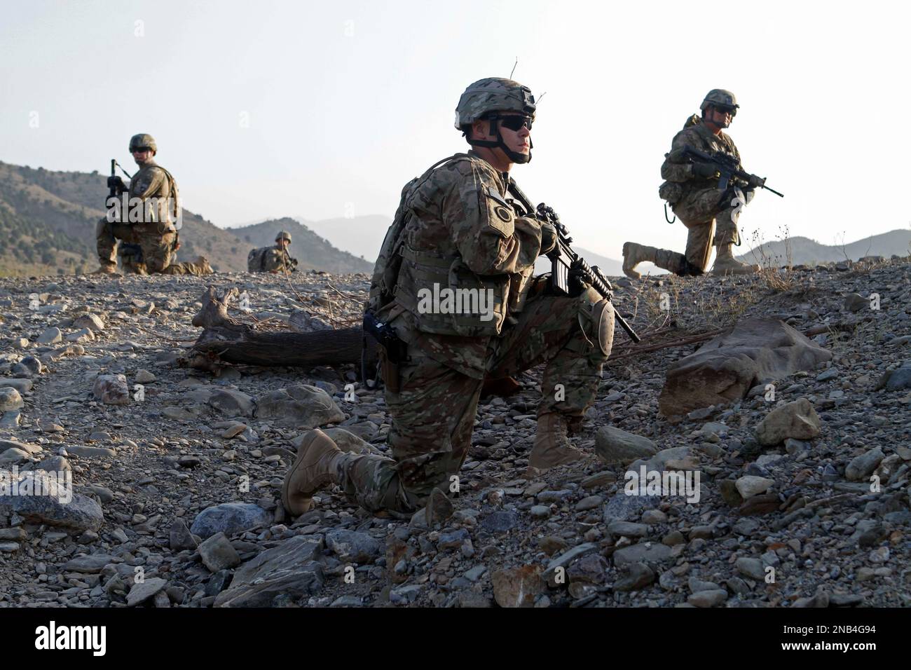 Staff Sgt. Joshua White, center, Command Sgt. Maj. John Troxell, left ...