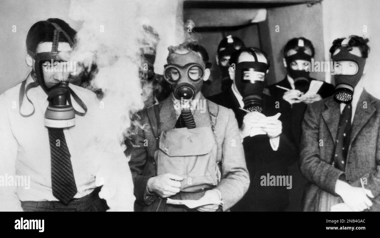 Left to right: John Fremlin, research physicist, wears a German gas ...