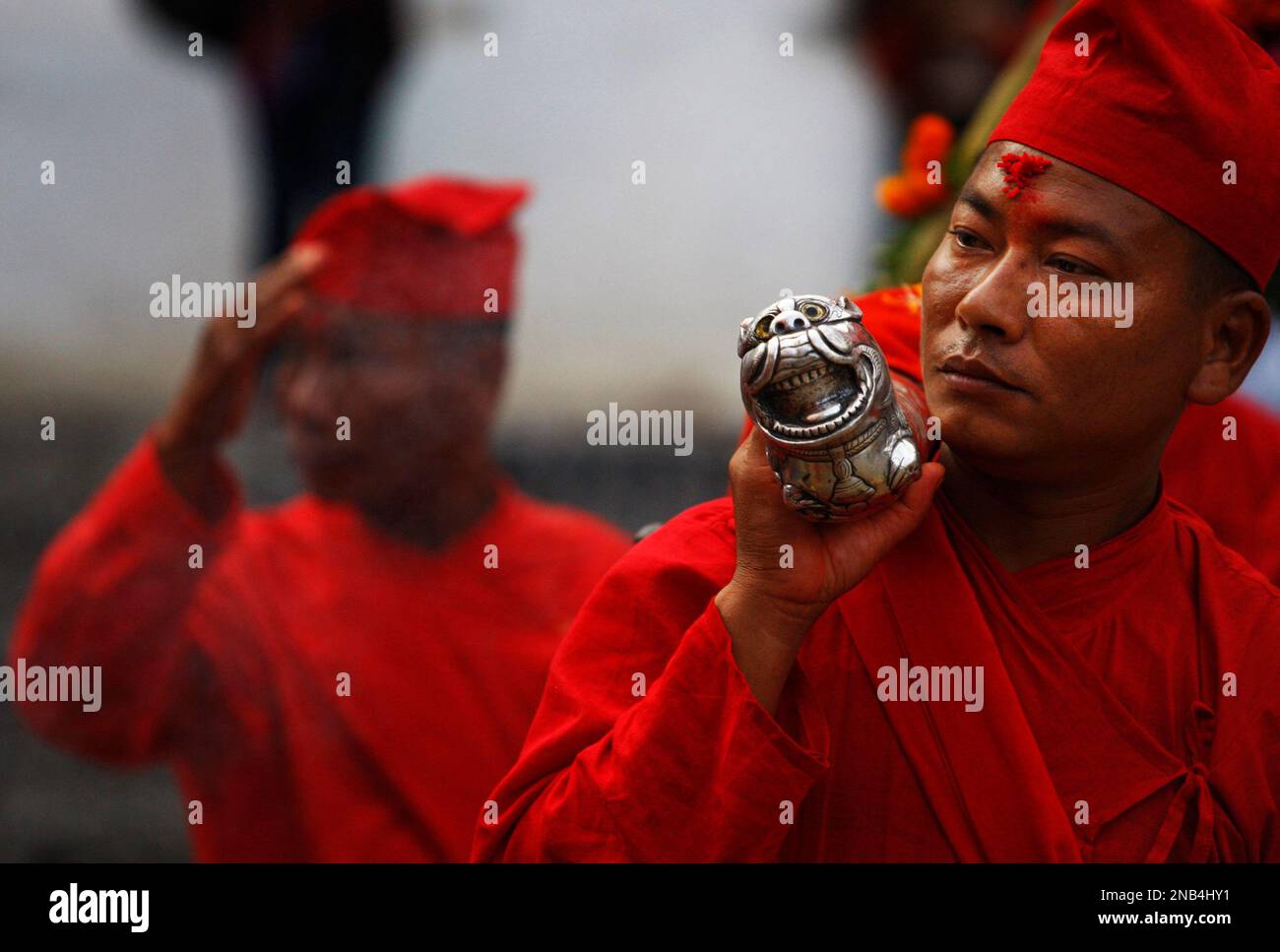 Nepalese priests carry Phulpati, an assortment of flowers, leaves and ...