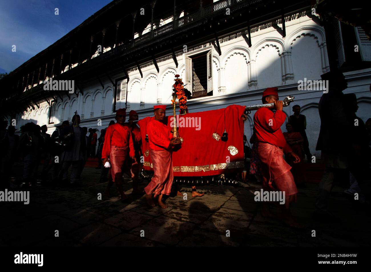 Nepalese priests carry Phulpati, an assortment of flowers, leaves and ...