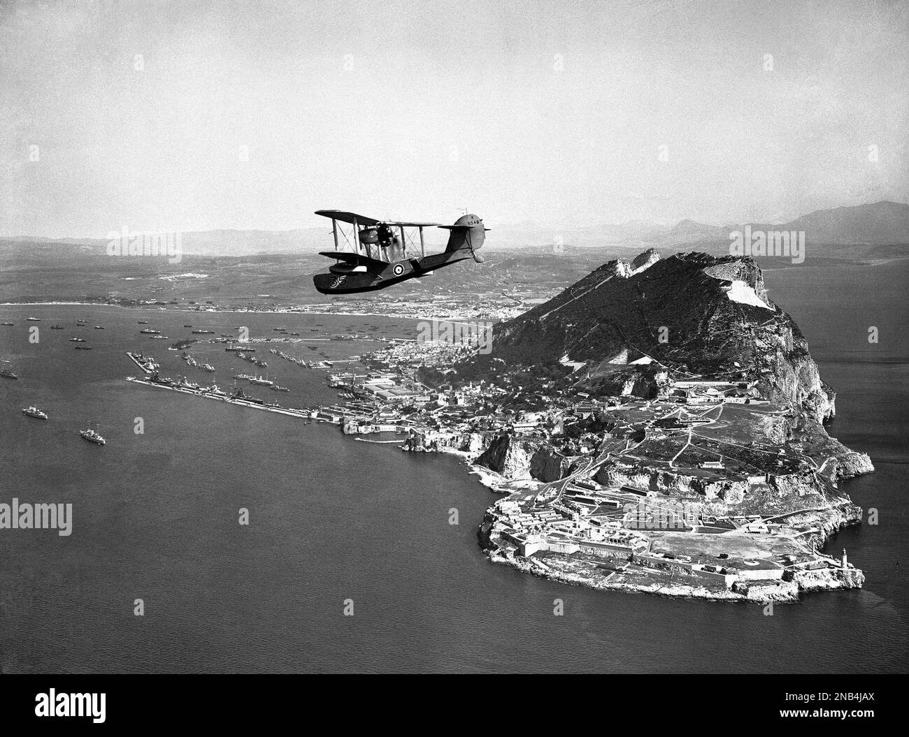 Aerial view a naval reconnaissance flying-boat is seen passing over the ...