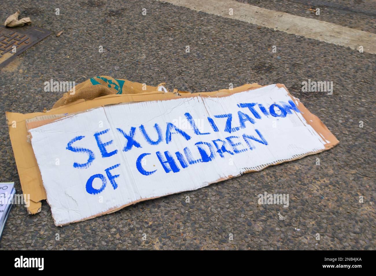 Sexualisation of Children placard on the floor as people were ...