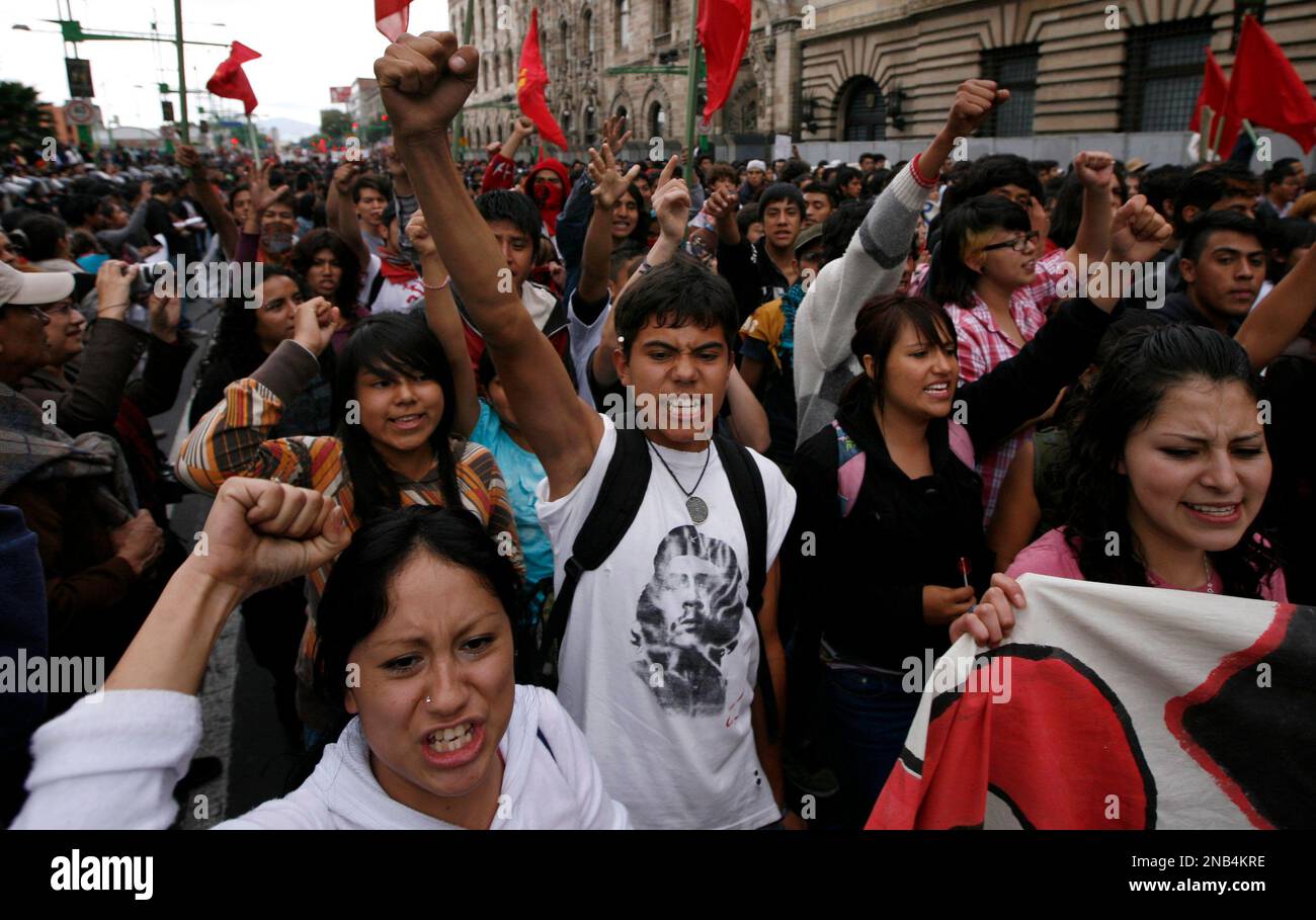 People demonstrate during a march marking the 43th anniversary of the ...