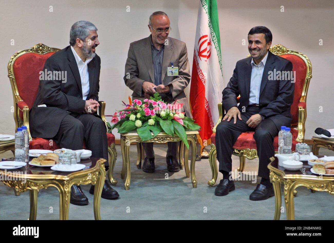 Palestinian Hamas leader Khaled Mashaal, left, and Iranian President ...