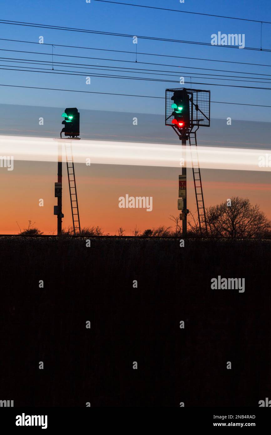 Grand Central train passing 4 and 3 aspect colour light railway signals ...