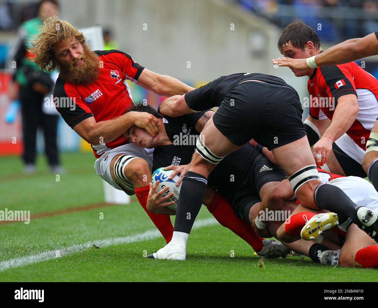 New Zealand All Blacks Zac Guildford is tackled by Canada's Adam ...