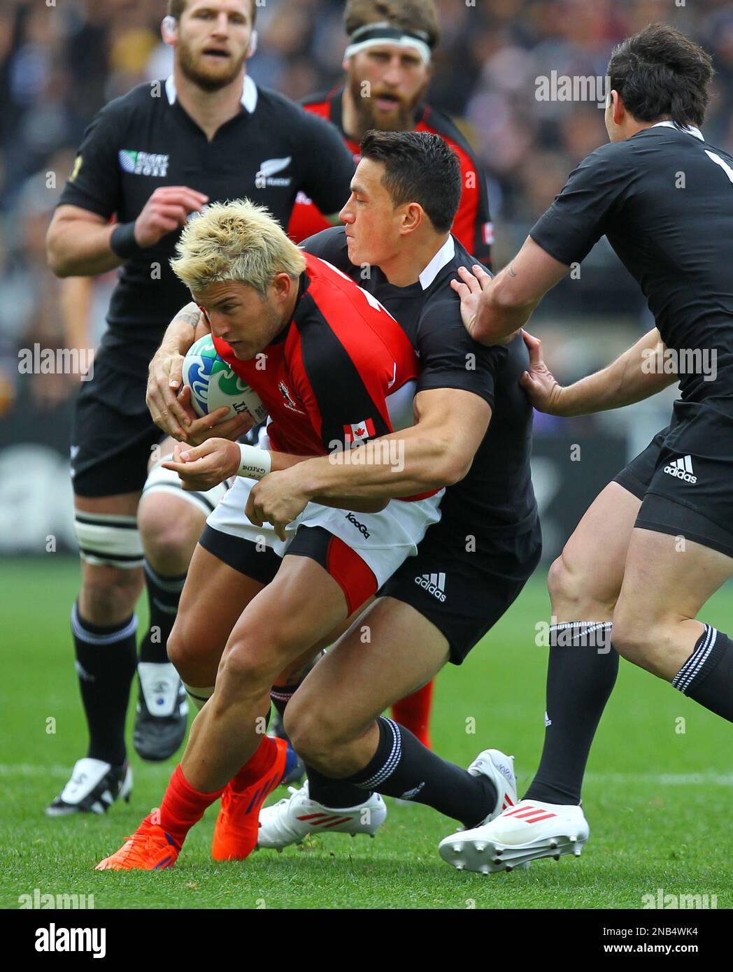 Canada's DTH van der Merwe is tackled by New Zealand All Blacks Sonny ...