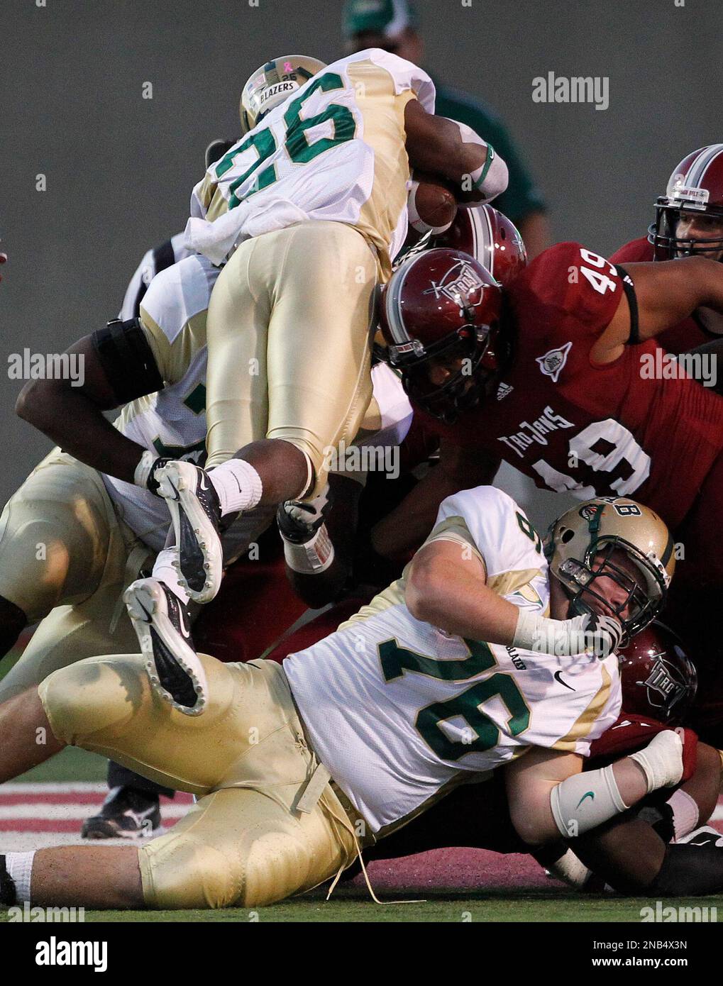 UAB running back Pat Shed (26) is stopped at the goal line by Troy ...