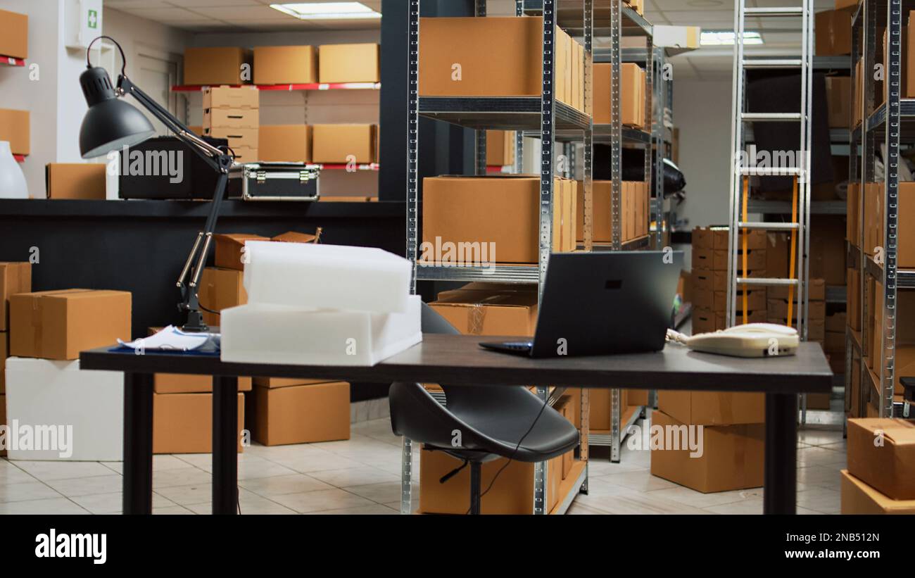 Empty storage room in retail warehouse area filled with cardboard boxes ...