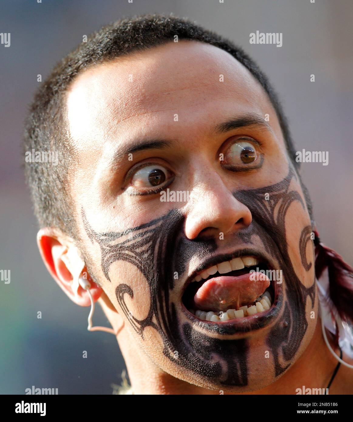 A Maori warrior welcomes the French and Tongan teams onto the field ...