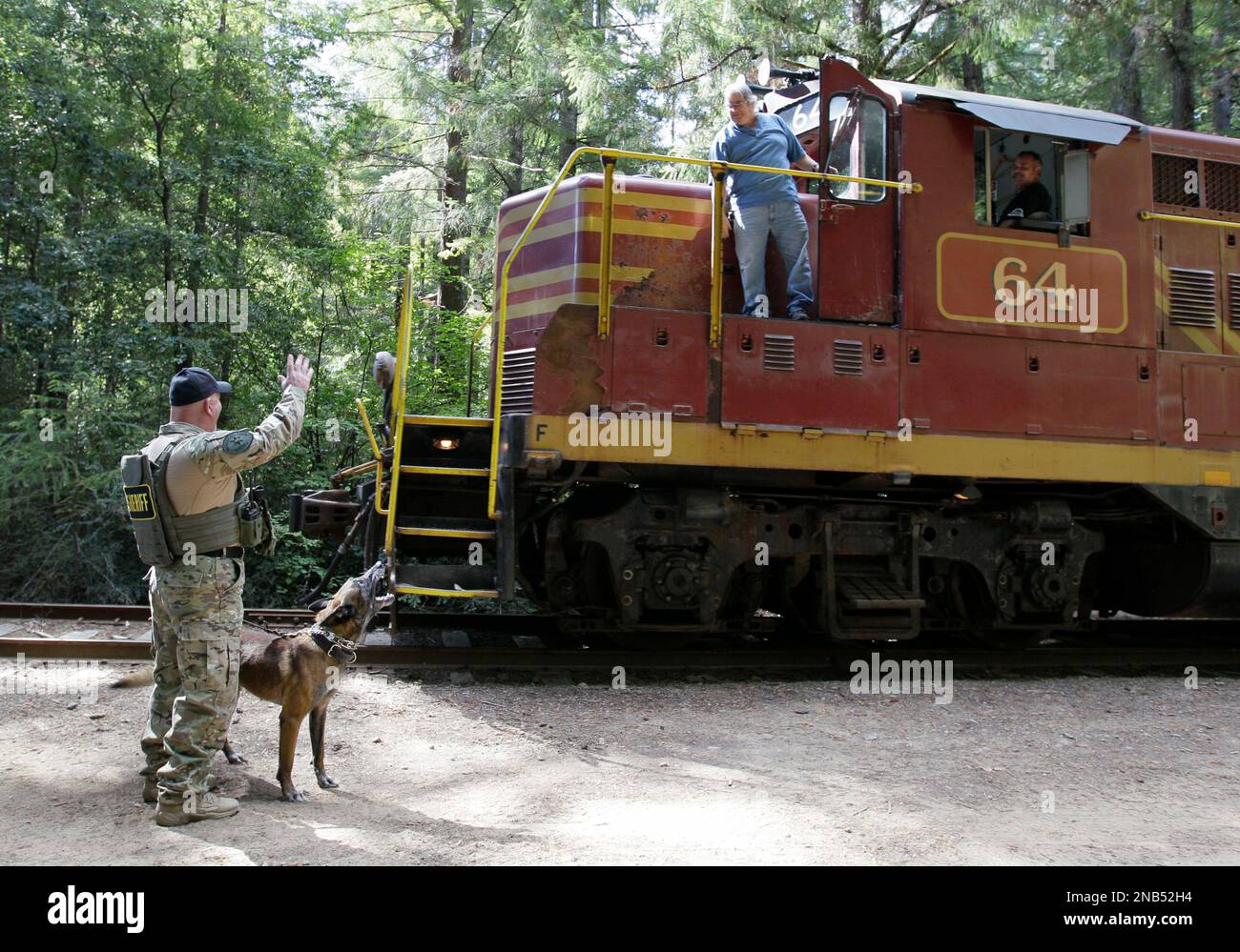 Mendocino County sheriff's deputy Joey DeMarco, left, with his patrol ...