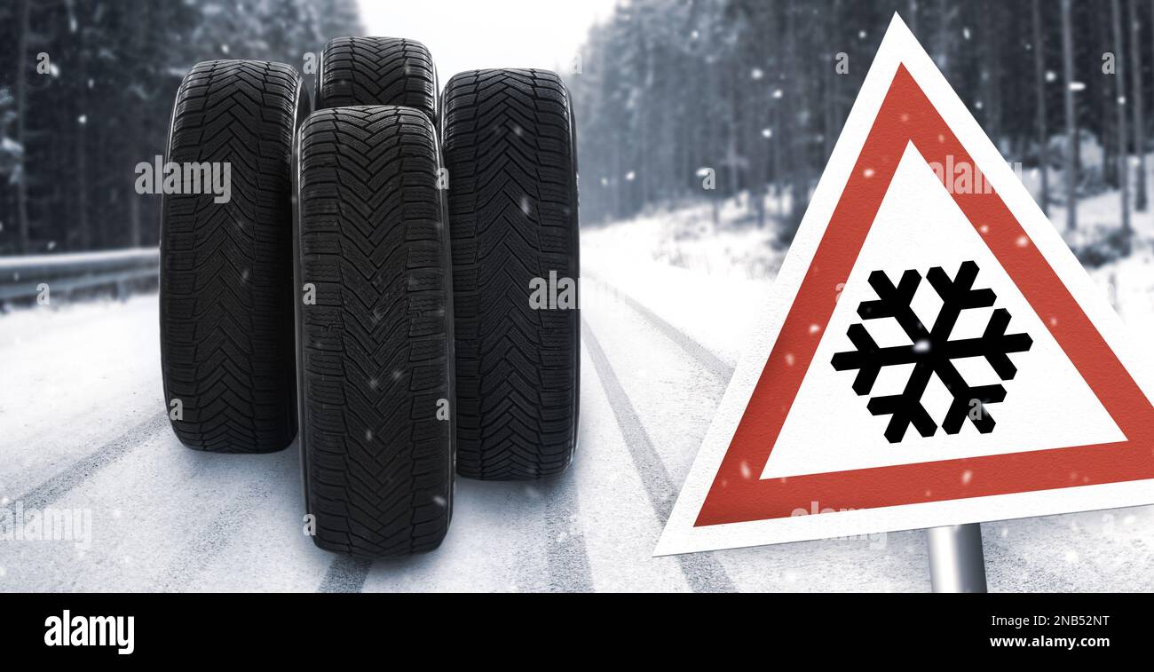 Set of winter tires and road sign outdoors Stock Photo - Alamy