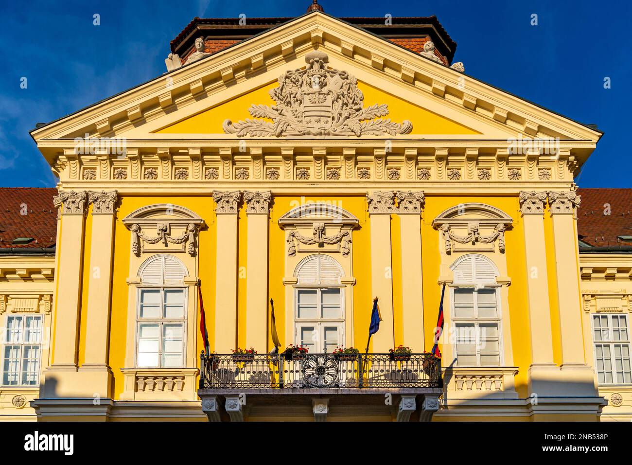 Yellow facade of the baroque bishop's palace in the summer sun Stock ...