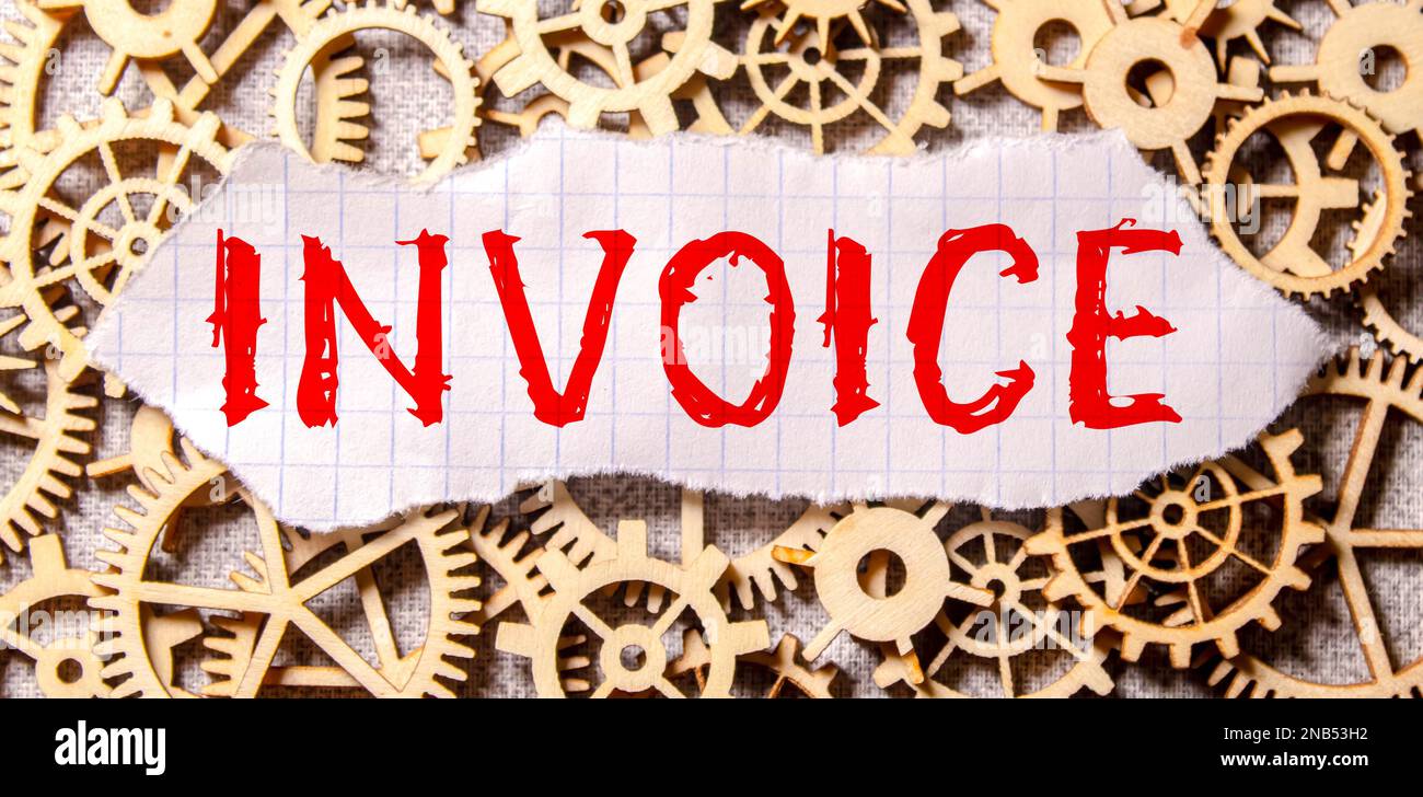 The word invoice on torn paper on red notepad Stock Photo - Alamy