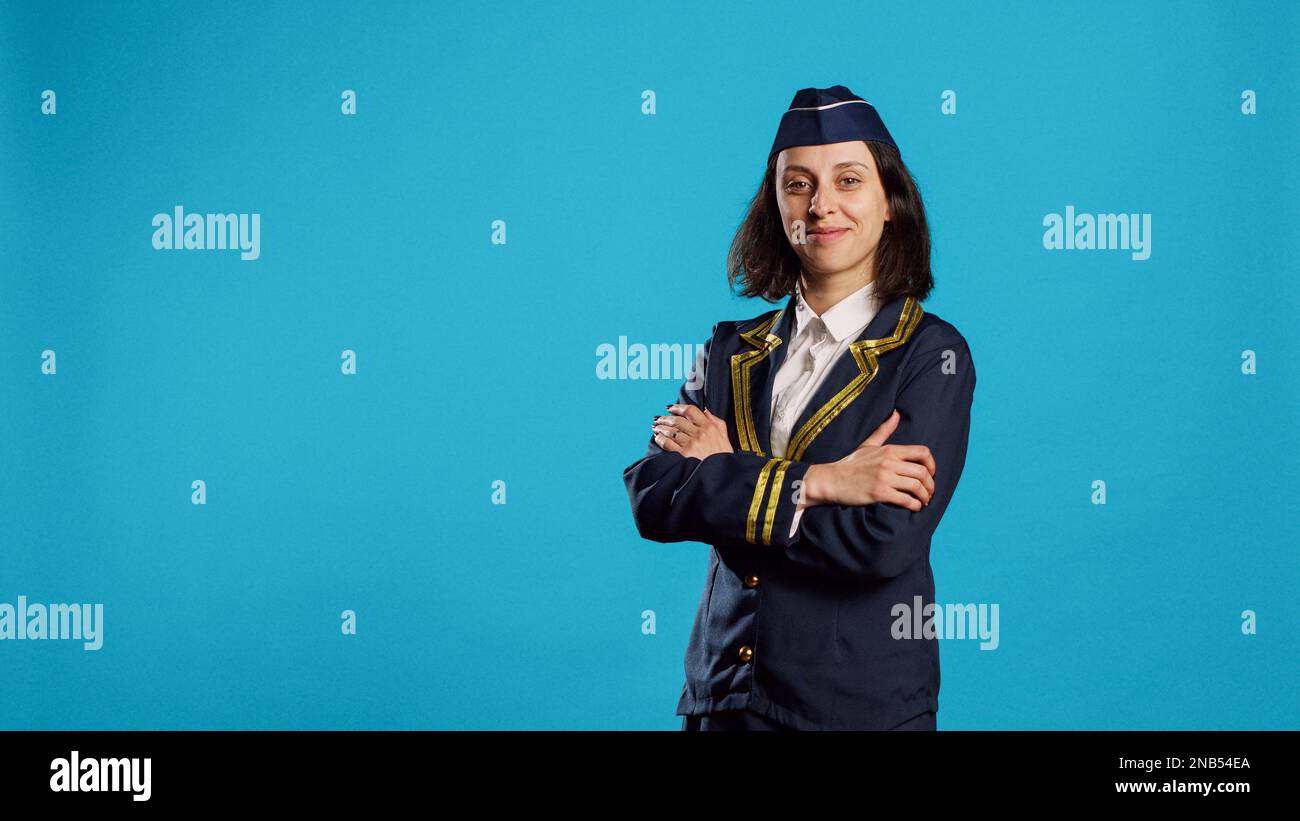 Happy woman airliner working as stewardess, wearing aviation uniform ...