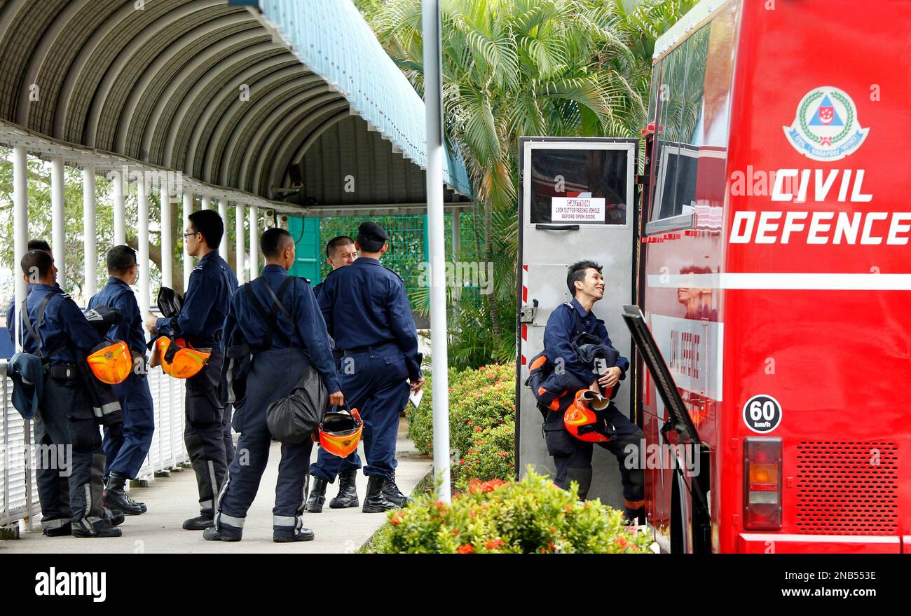 Singapore Civil Defense Force personnel prepare for duty at the Royal ...