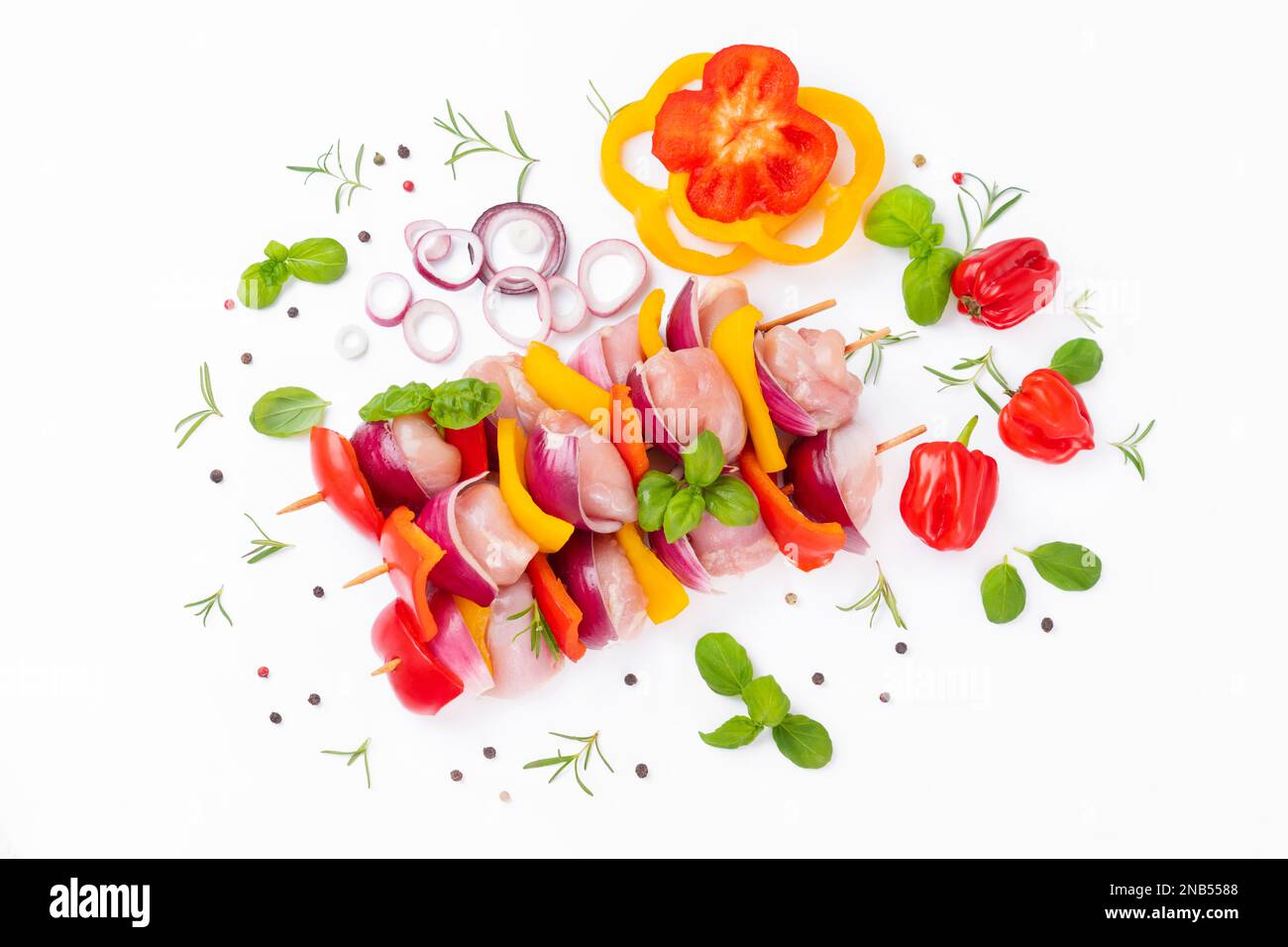 Uncooked mixed meat skewer with peppers.Skewers with pieces of raw meat ...