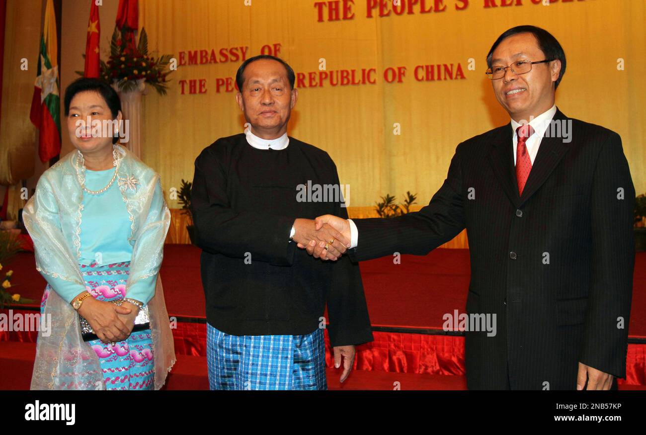 Myanmar's vice president Thiha Thura Tin Aung Myint Oo, centre, shakes hands with Li Junhua ...
