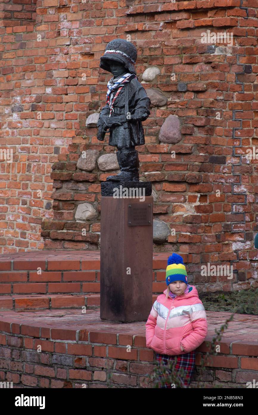 A child standing by the Mały Powstaniec - The Little Insurrectionist ...