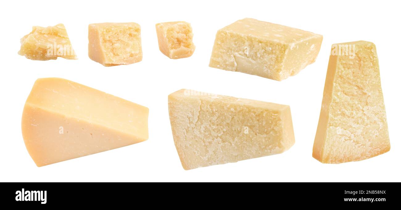 Set with pieces of delicious parmesan cheese on white background ...