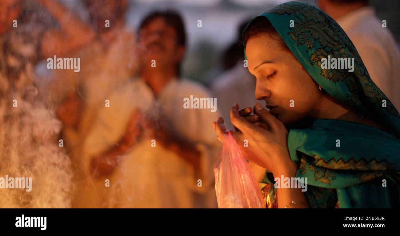 A Pakistani eunuch chants prayers while visiting the local shrine of ...