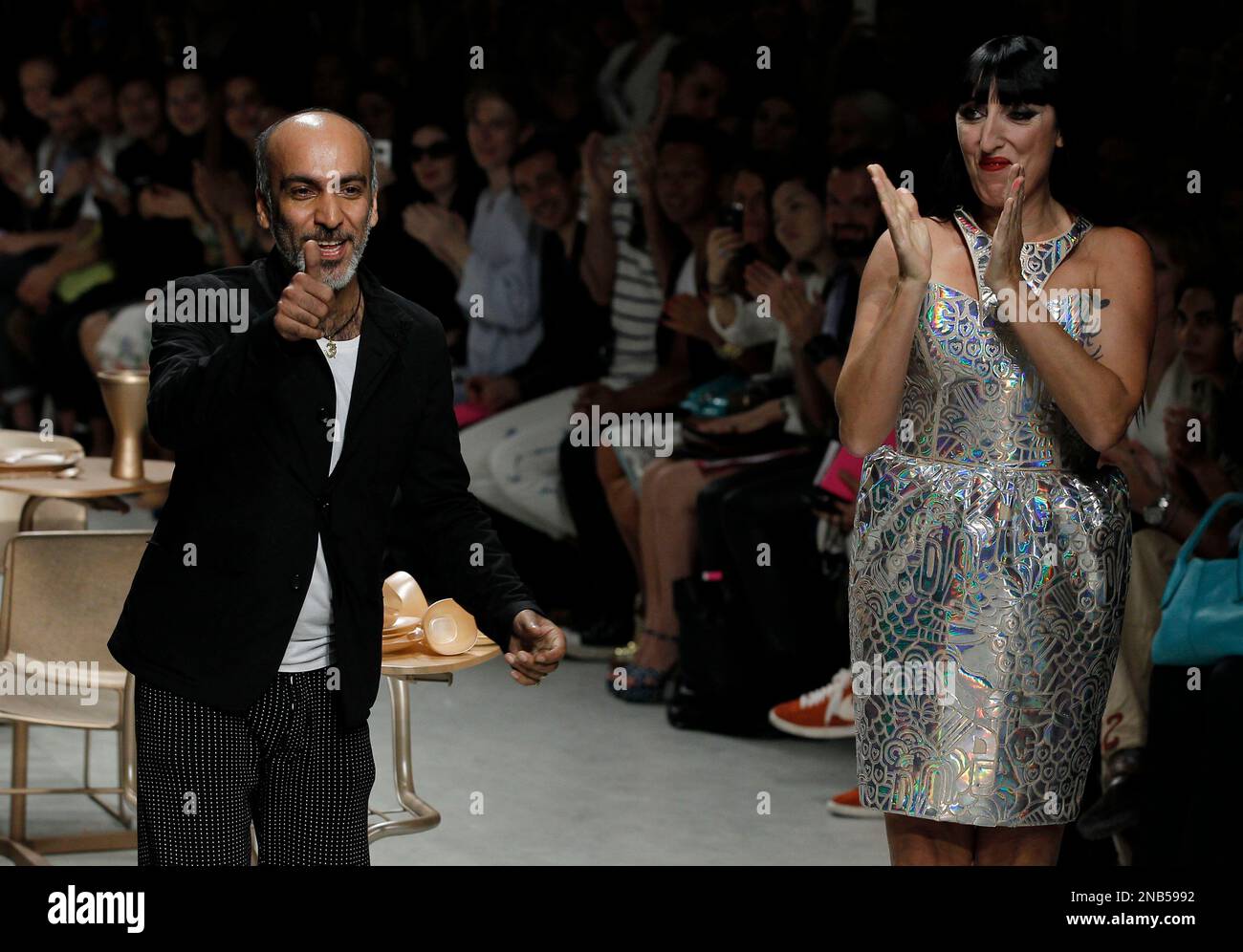 Spanish actress Rossy de Palma, right, applauds Indian fashion designer ...
