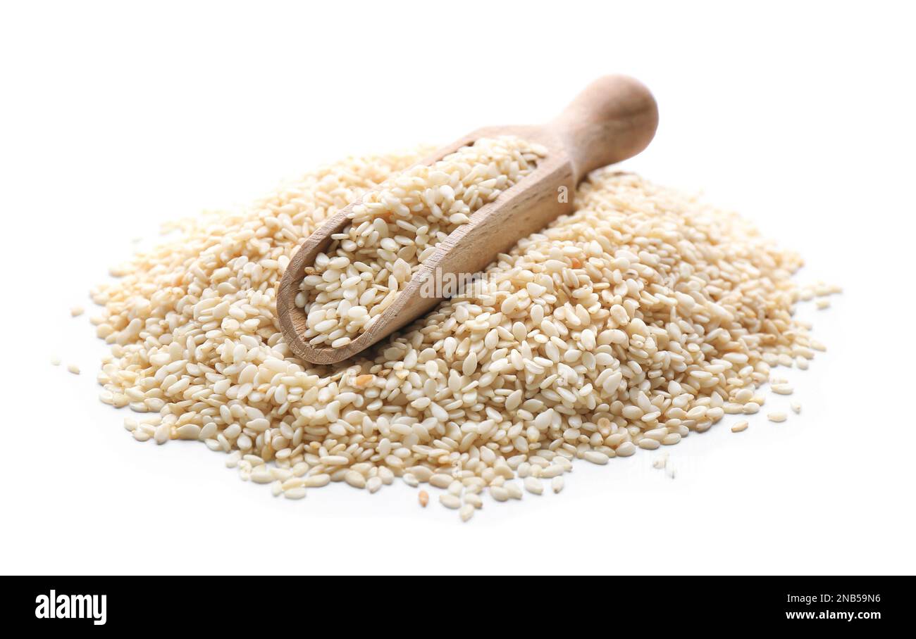 Pile of sesame seeds and wooden scoop on white background Stock Photo ...