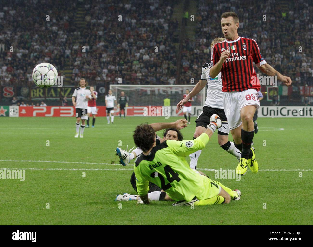 AC Milan forward Antonio Cassano, right, scores during a Champions ...