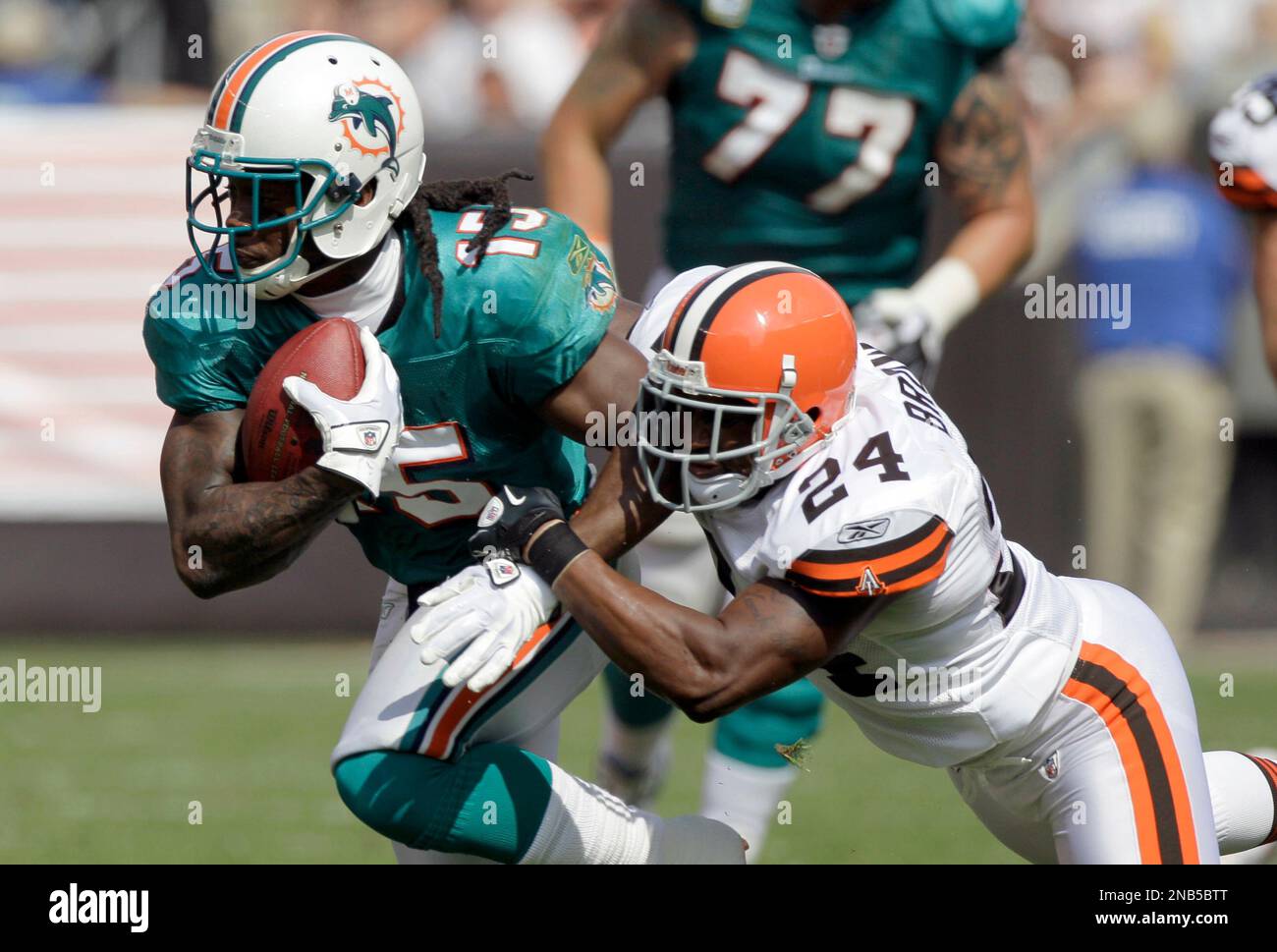 Miami Dolphins wide receiver Davone Bess (15) is tackled by Cleveland ...