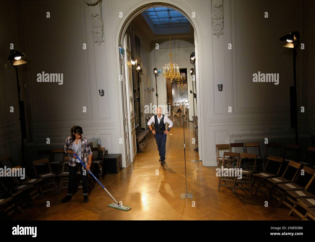 Workers prepare the room before the presentation of Rochas' spring ...