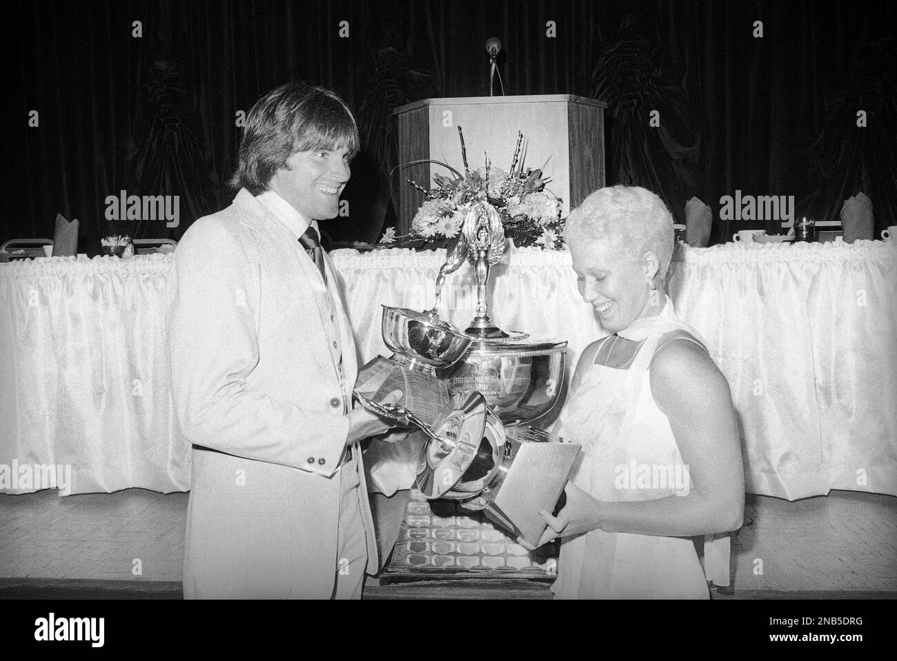 Bruce Jenner, left, the Olympic decathlon champion, looks over the ...