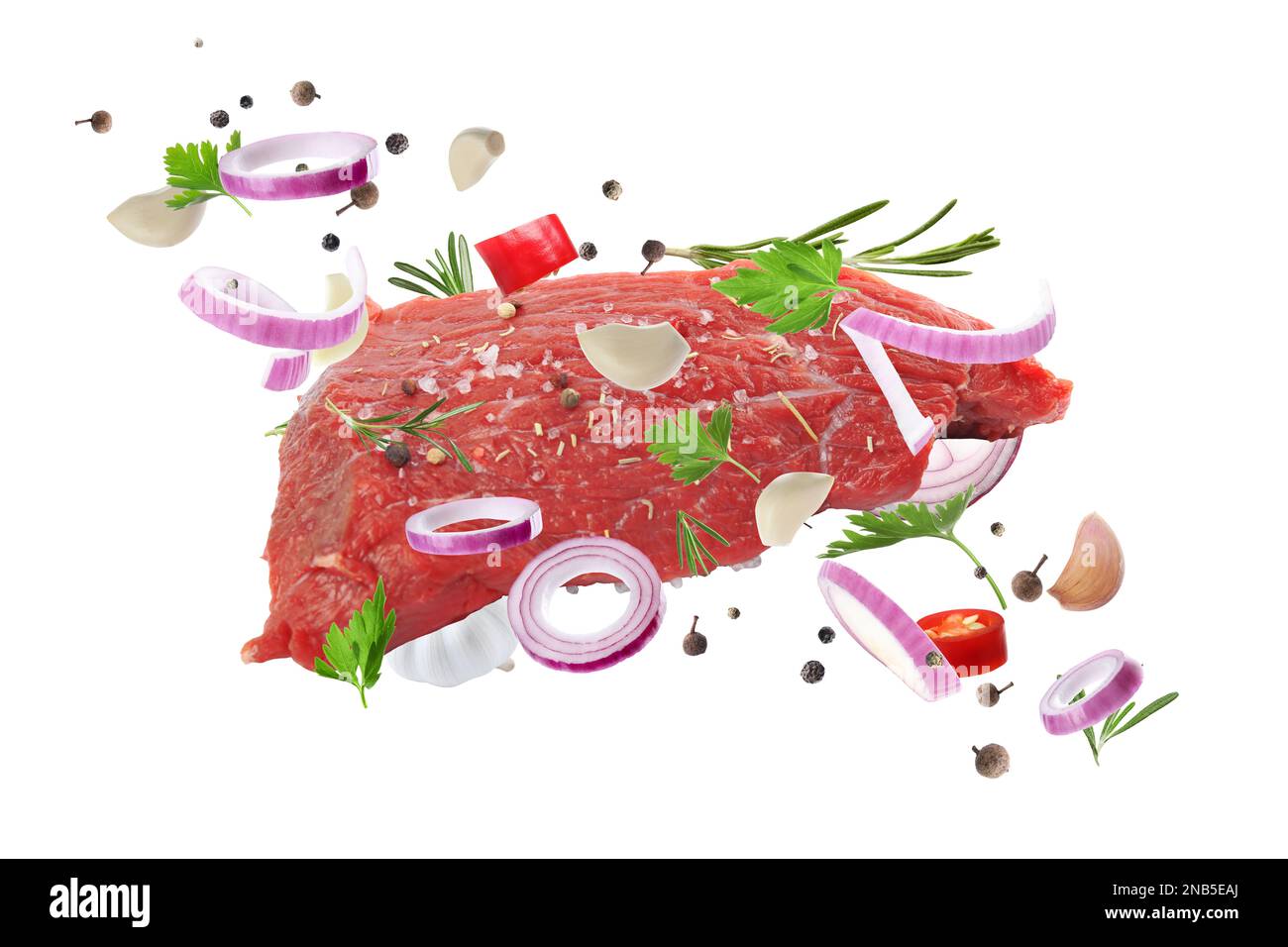 Fresh raw meat and different spices flying on white background Stock ...