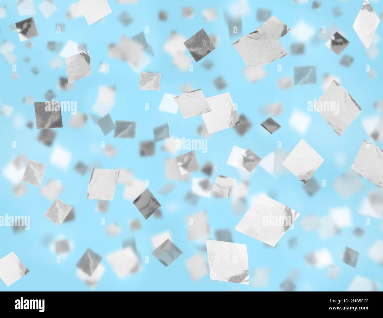 White confetti falling down on light blue background Stock Photo - Alamy