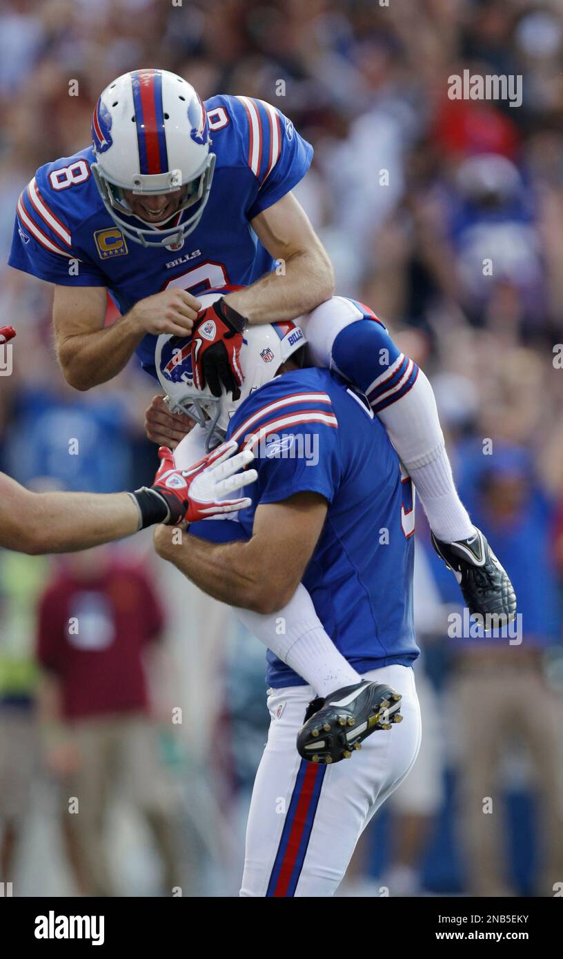 Buffalo Bills' Rian Lindell (9) celebrates the game-winning field goal ...